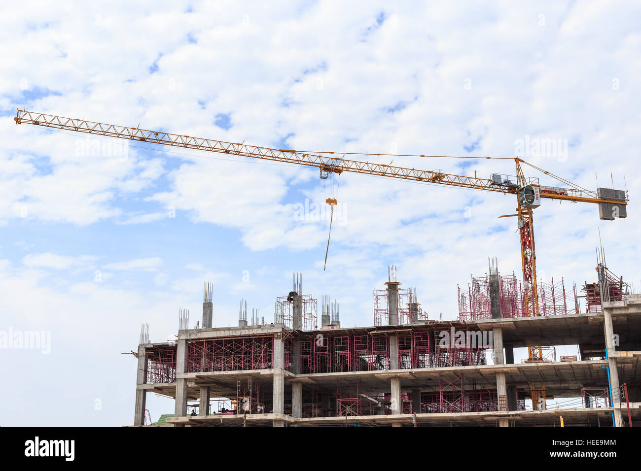 Big construction crane and the building against the sky background ...
