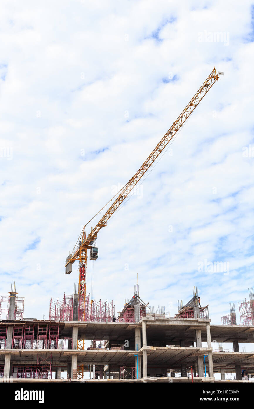 Big construction crane and the building against the sky background ...