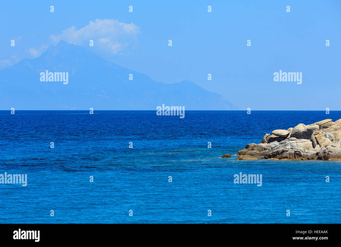 Aegean sea coast landscape with aquamarine water and Mount Athos in ...