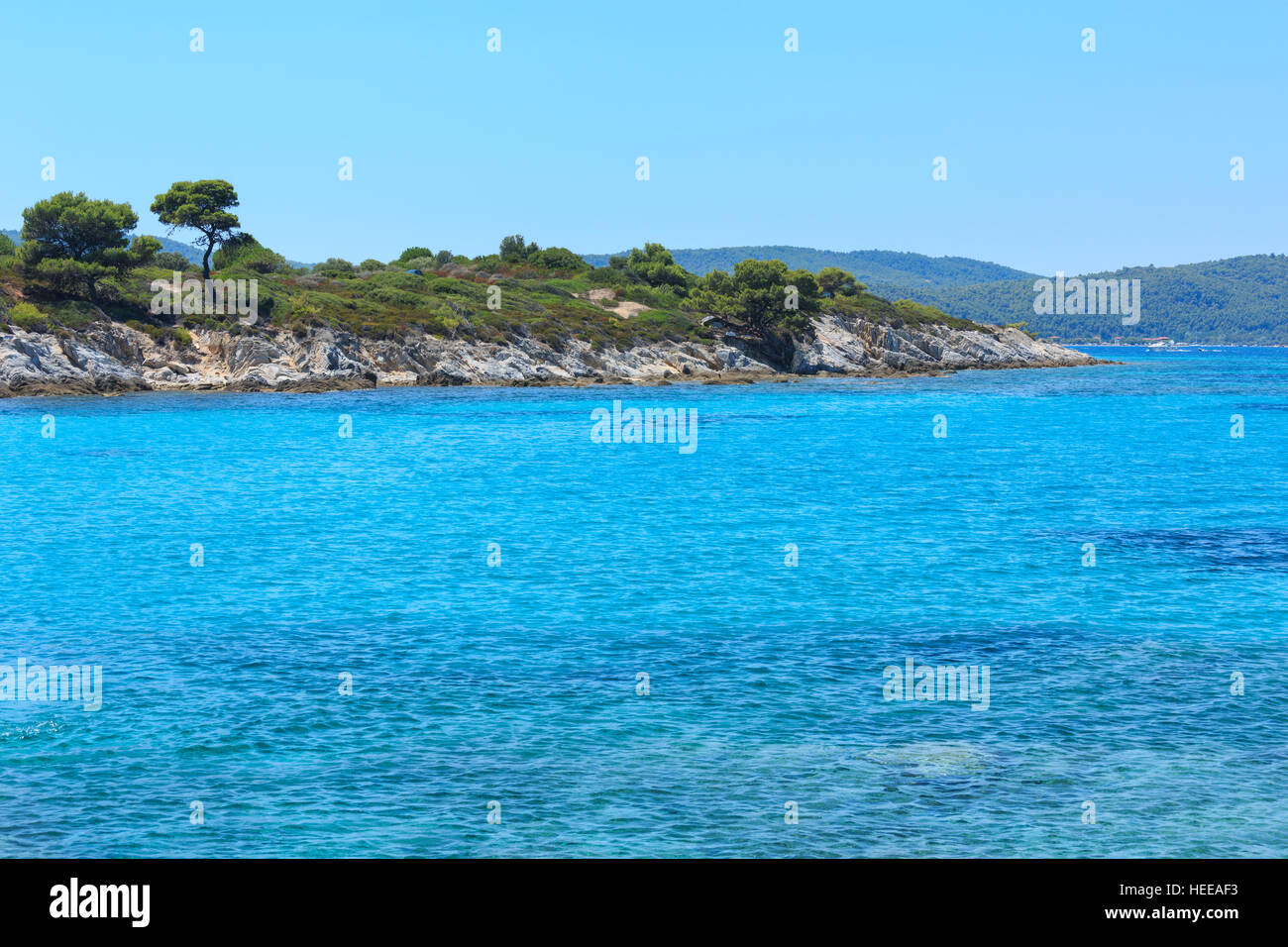 Aegean sea coast landscape and tent on slope, view near Karidi beach ...