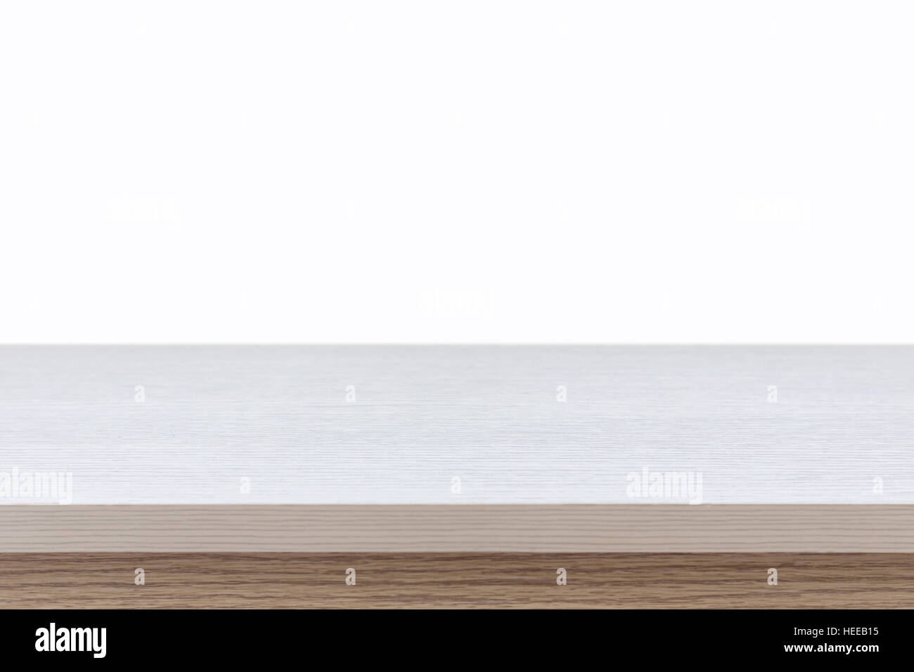 Empty top of wooden table or counter isolated on white background. For ...