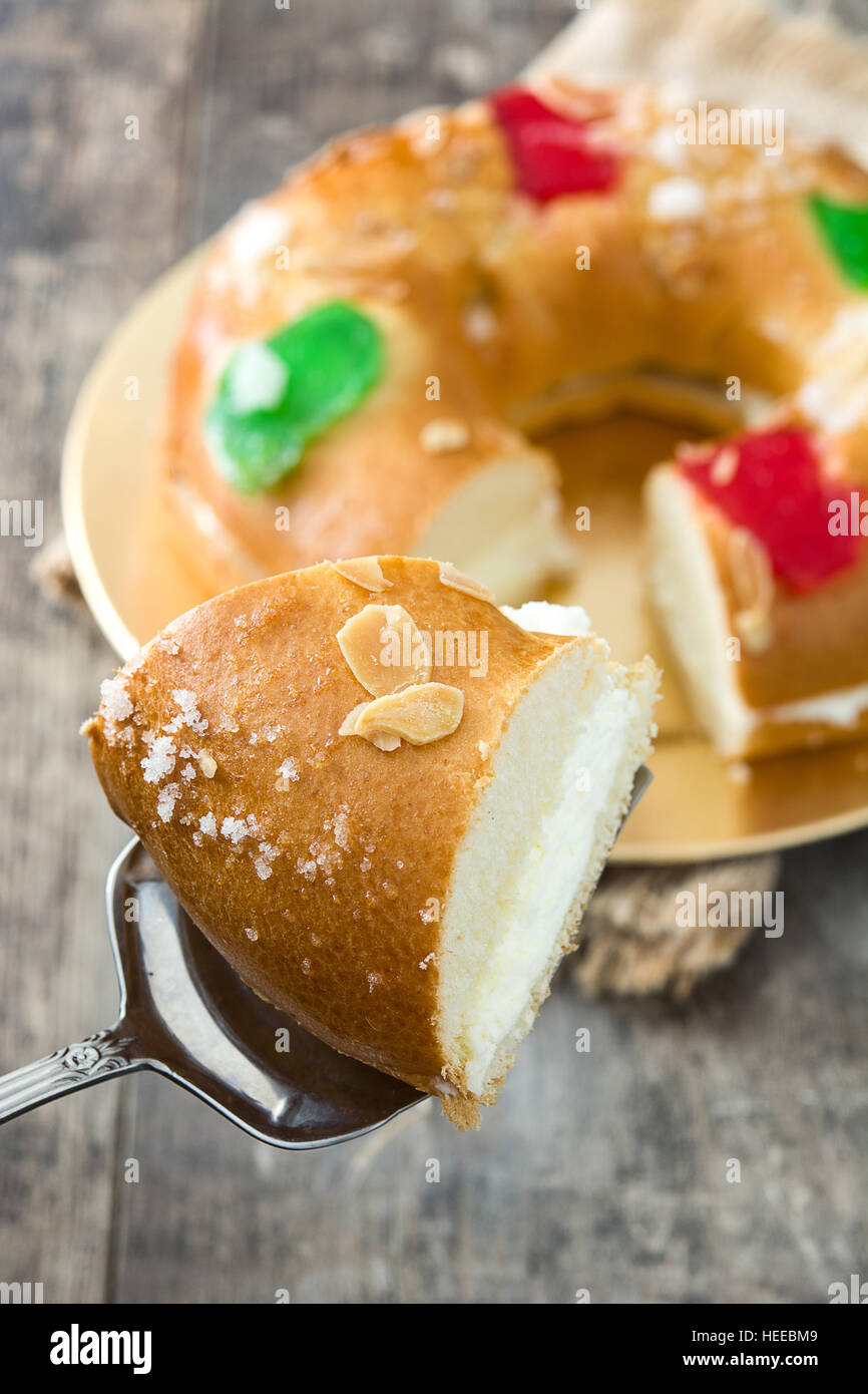Spanish typical epiphany cake "Roscon de Reyes", on wooden background ...