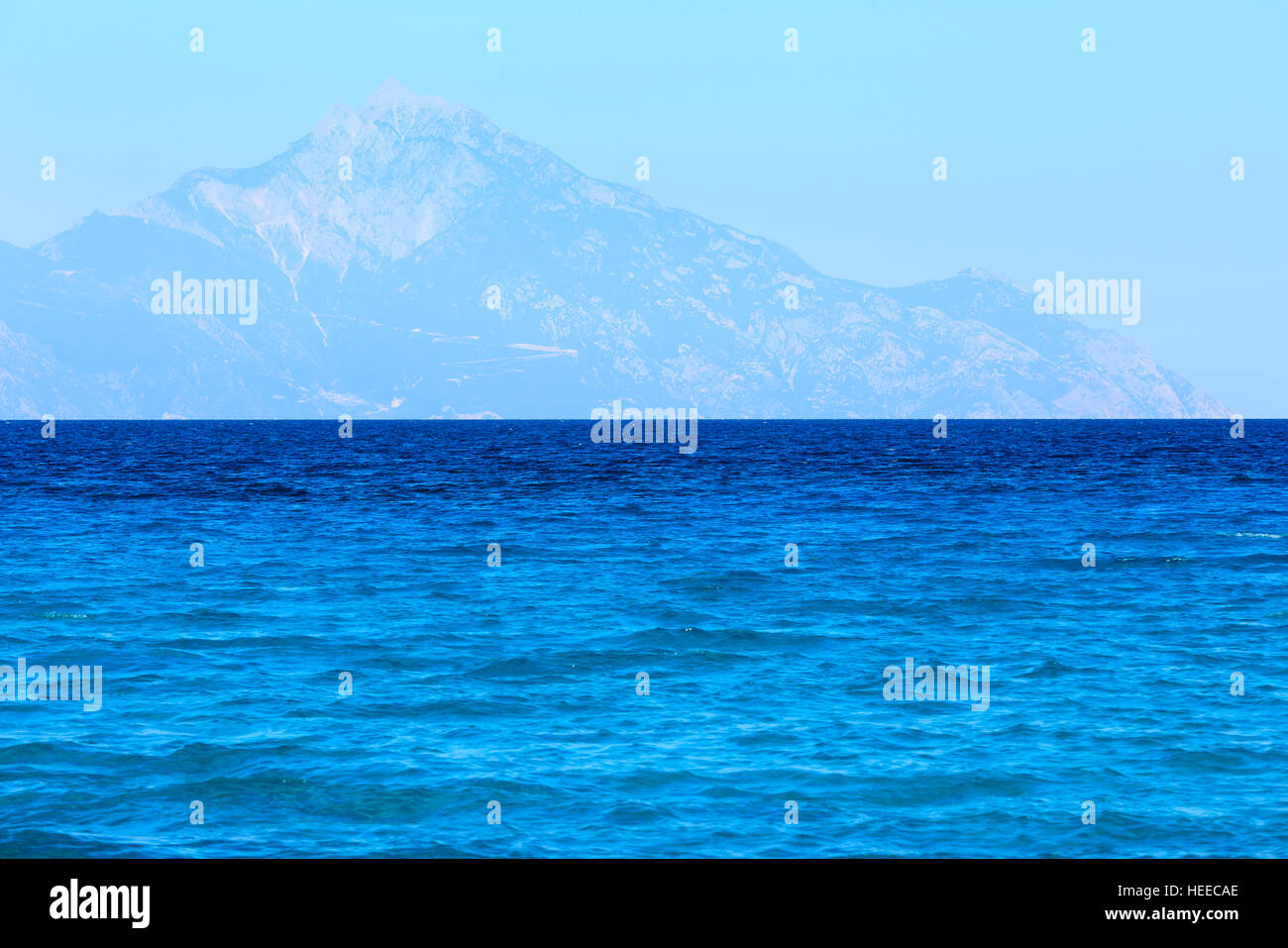 Aegean sea coast landscape with aquamarine water and Mount Athos in ...