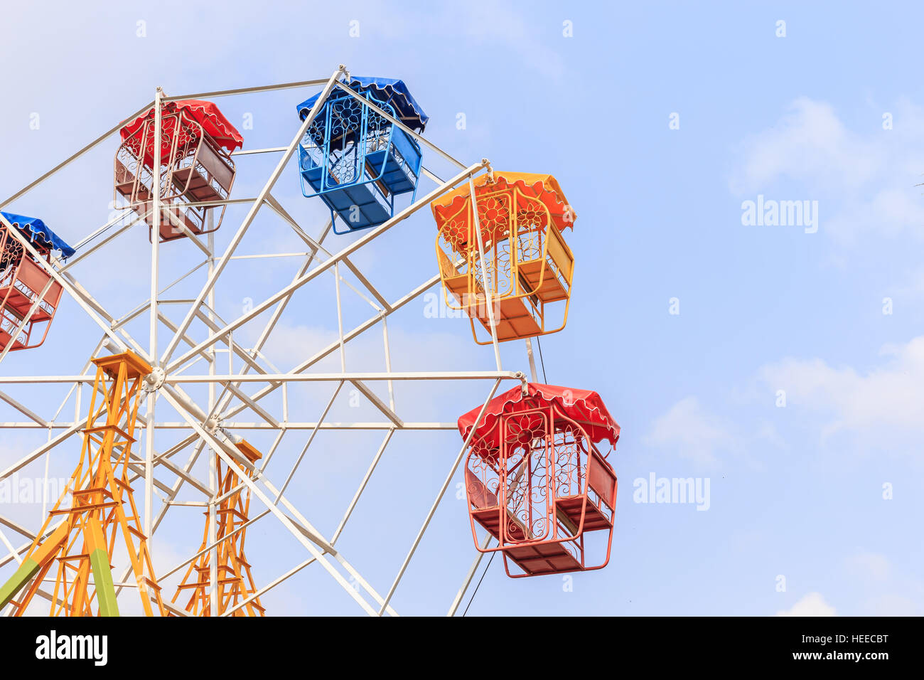 Brightly colored Ferris wheel against the blue sky Stock Photo - Alamy