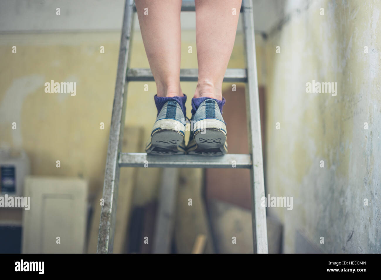 Woman ladder attic hi-res stock photography and images - Alamy
