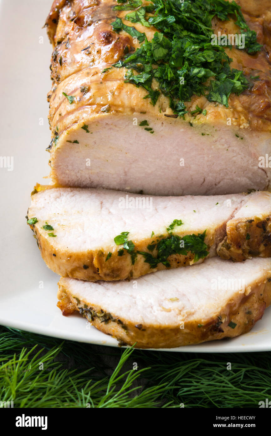 Roasted pork on wooden table Stock Photo - Alamy