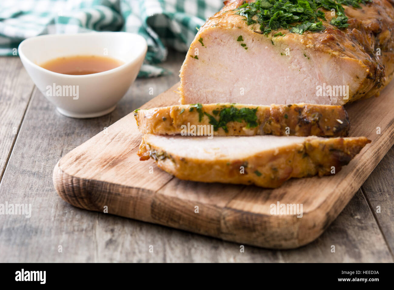 Roasted pork on wooden table Stock Photo - Alamy