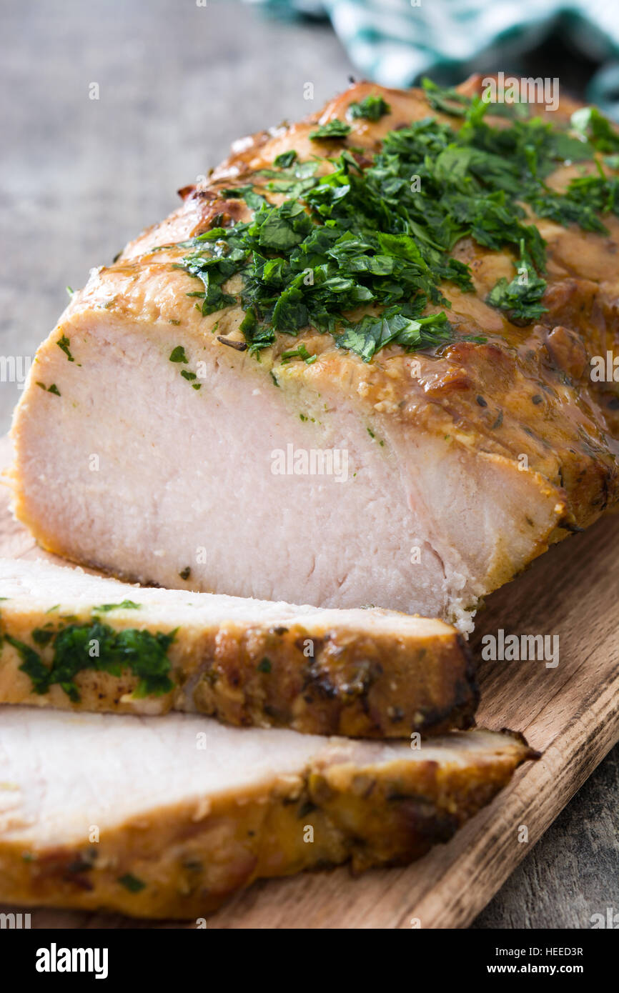 Roasted pork on wooden table Stock Photo - Alamy