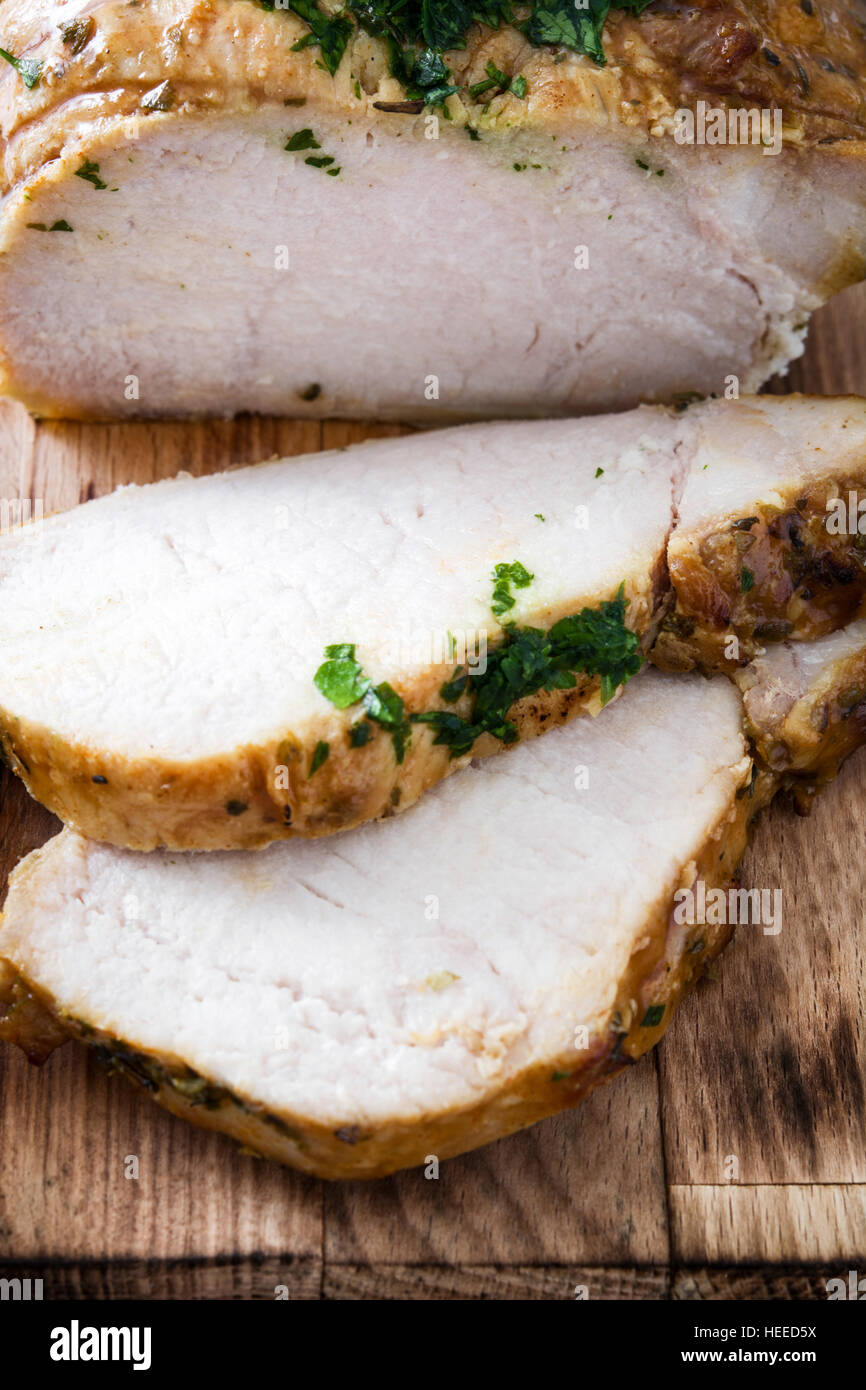 Roasted pork on wooden table Stock Photo - Alamy