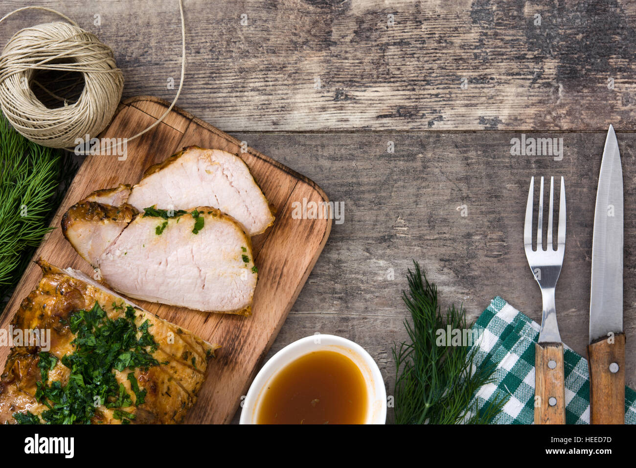 Roasted pork on wooden table Stock Photo - Alamy