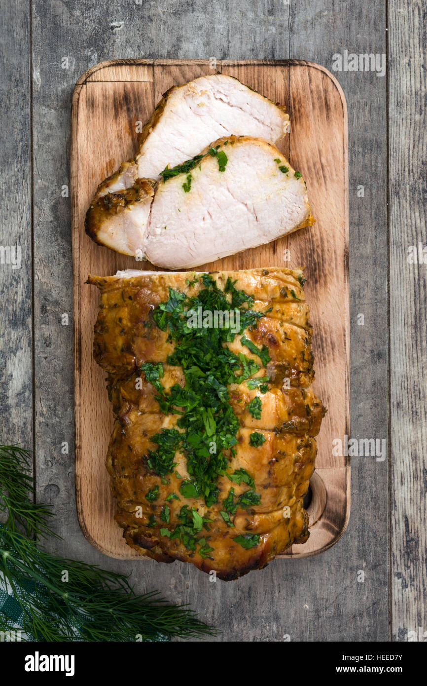 Roasted pork on wooden table Stock Photo - Alamy