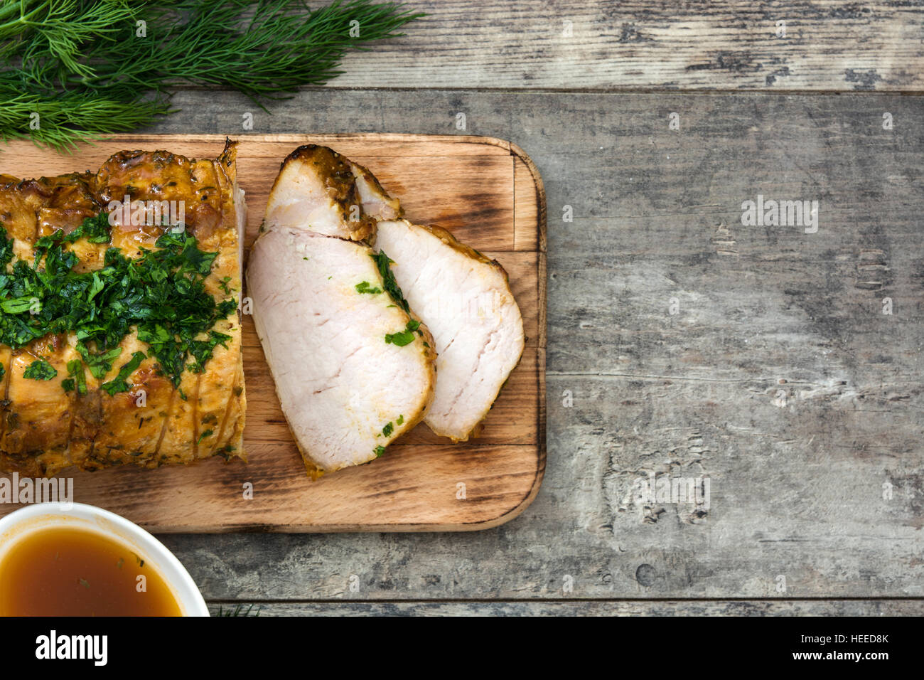 Roasted pork on wooden table Stock Photo - Alamy