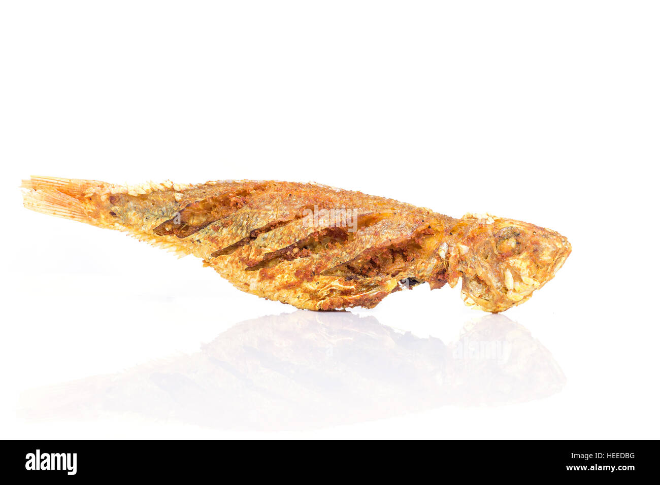 Thai style fish fried isolated on white background Stock Photo - Alamy