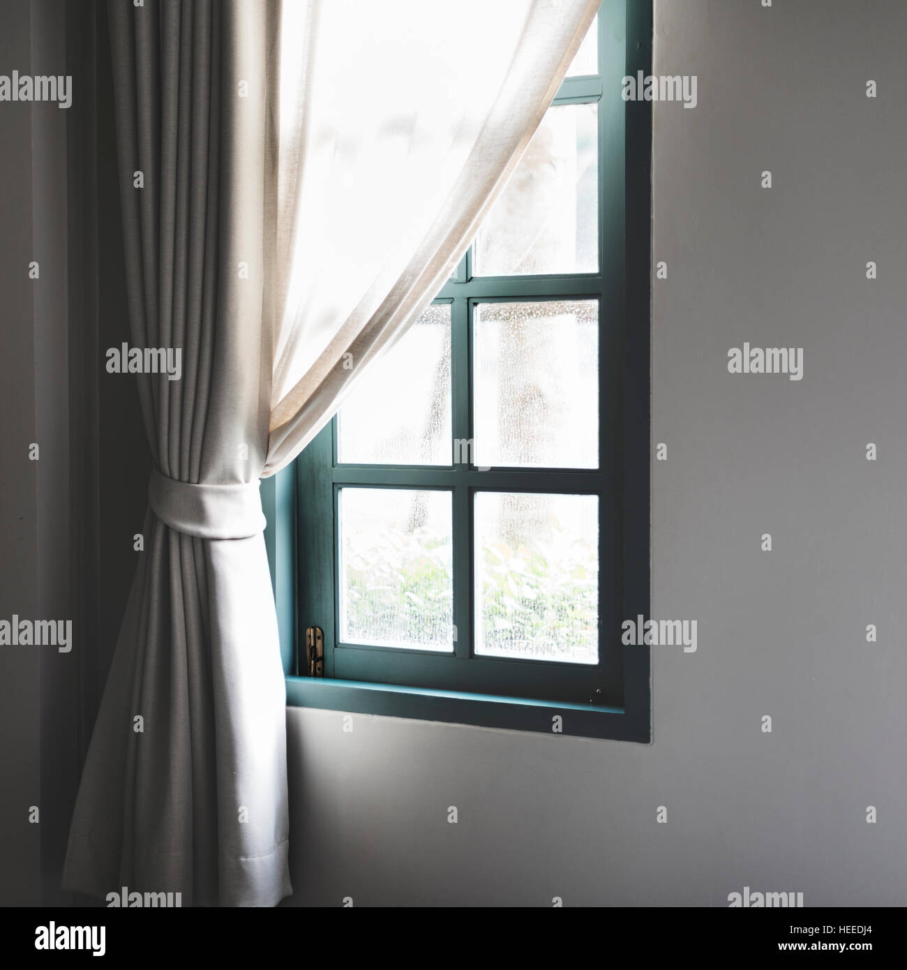 Simple window with white curtain Stock Photo - Alamy