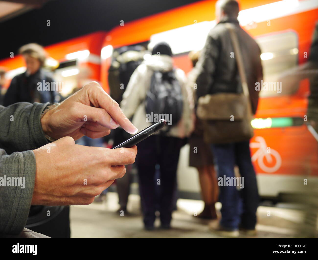 Man texting on train hi-res stock photography and images - Alamy