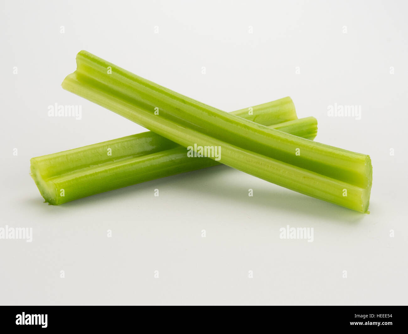 Celery Stalk Cut in Two Isolated on White Background Stock Photo - Alamy