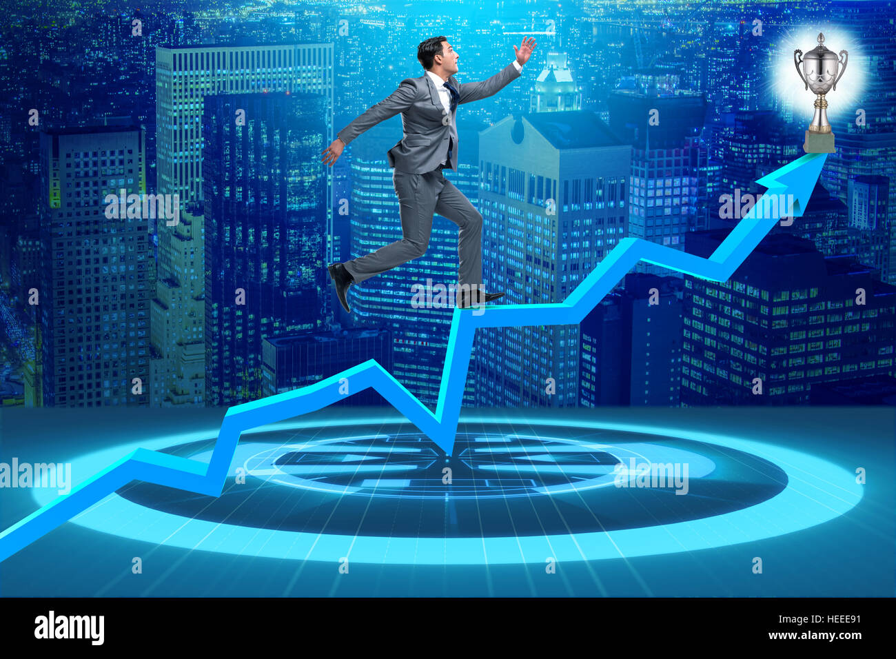 Businessman running towards prize cup trophy Stock Photo - Alamy