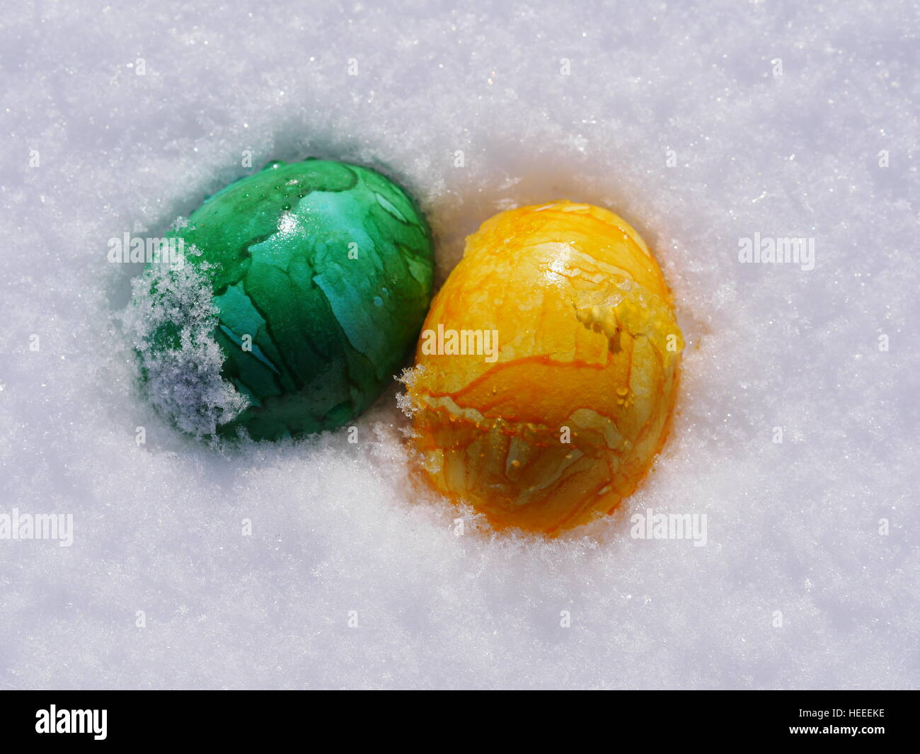 Easter eggs in snow Stock Photo - Alamy