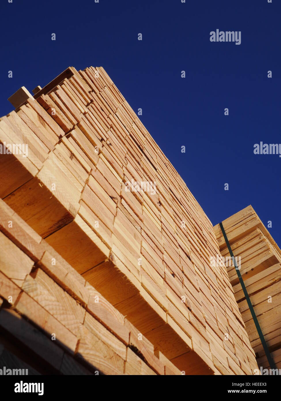 Stacks of planks against the deep blue sky Stock Photo - Alamy