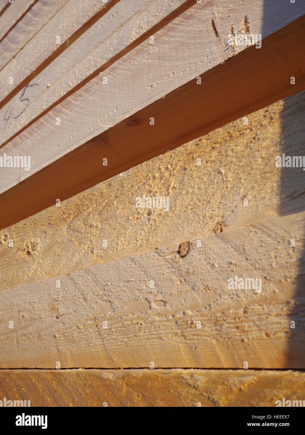 Stacks of planks against the deep blue sky Stock Photo - Alamy