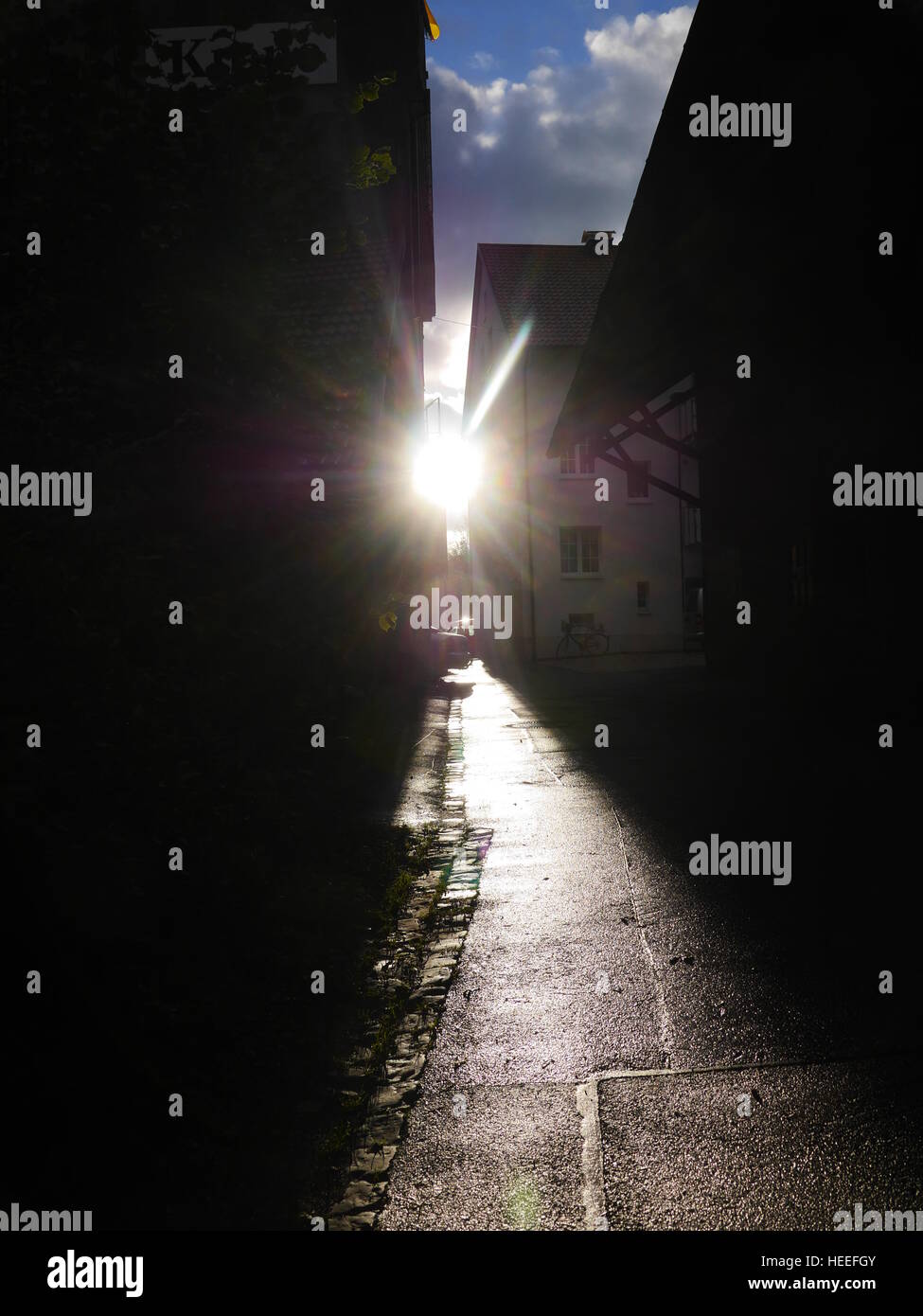 Sunburst between two buildings Stock Photo - Alamy
