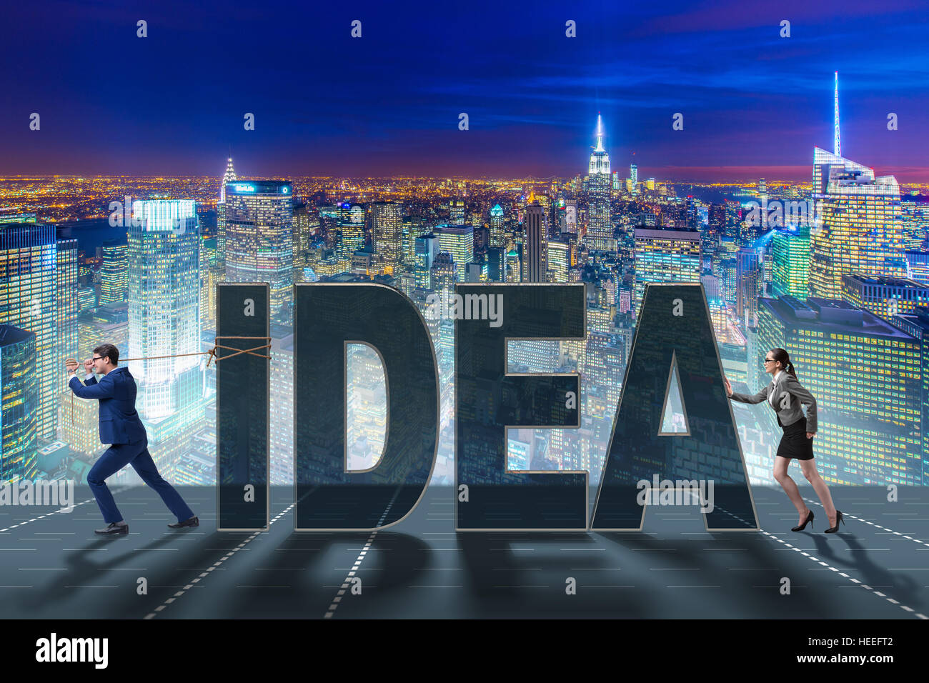Businesswoman and businessman in idea concept Stock Photo - Alamy