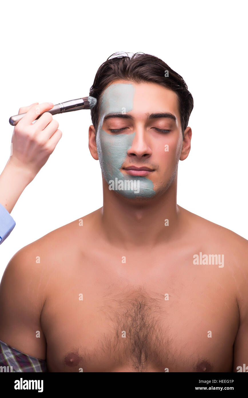 Man with face mask being applied on white Stock Photo - Alamy