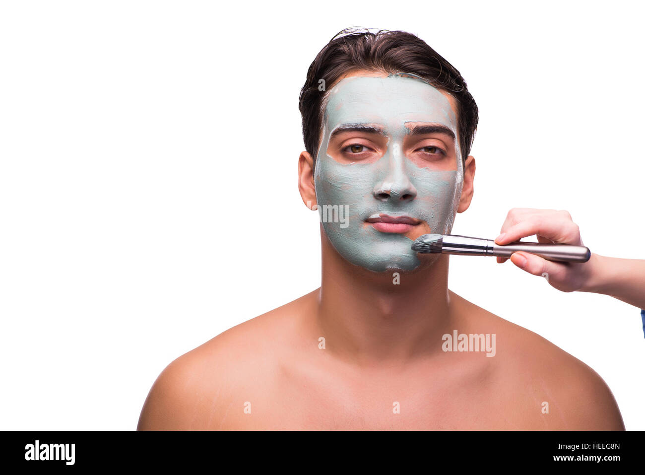 Man with face mask being applied on white Stock Photo - Alamy