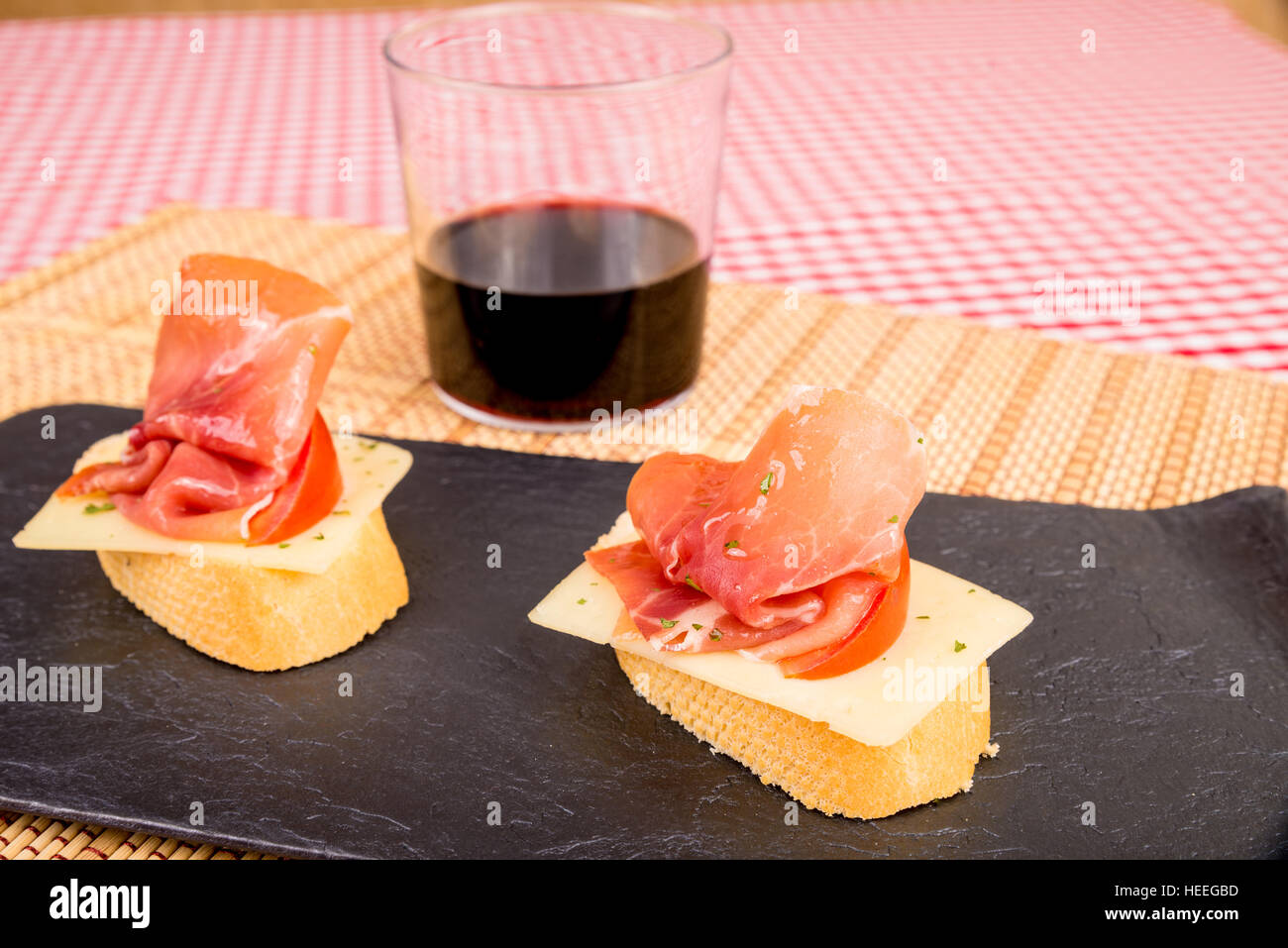 Traditional Spanish pincho style serrano ham tapa Stock Photo - Alamy