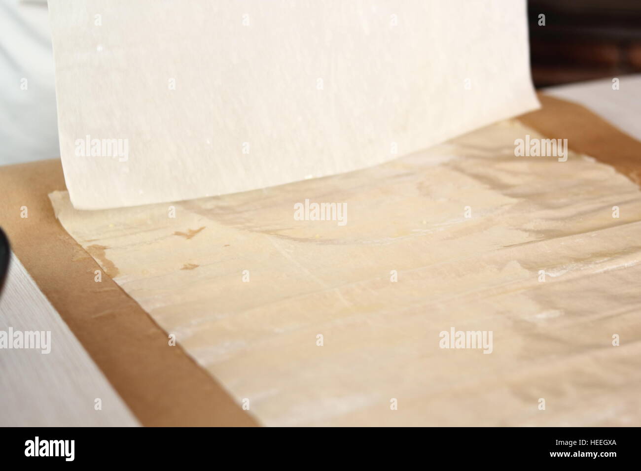 Stacking filo pastry sheet. Making Filo Pastry Topped Apple Pie Series ...