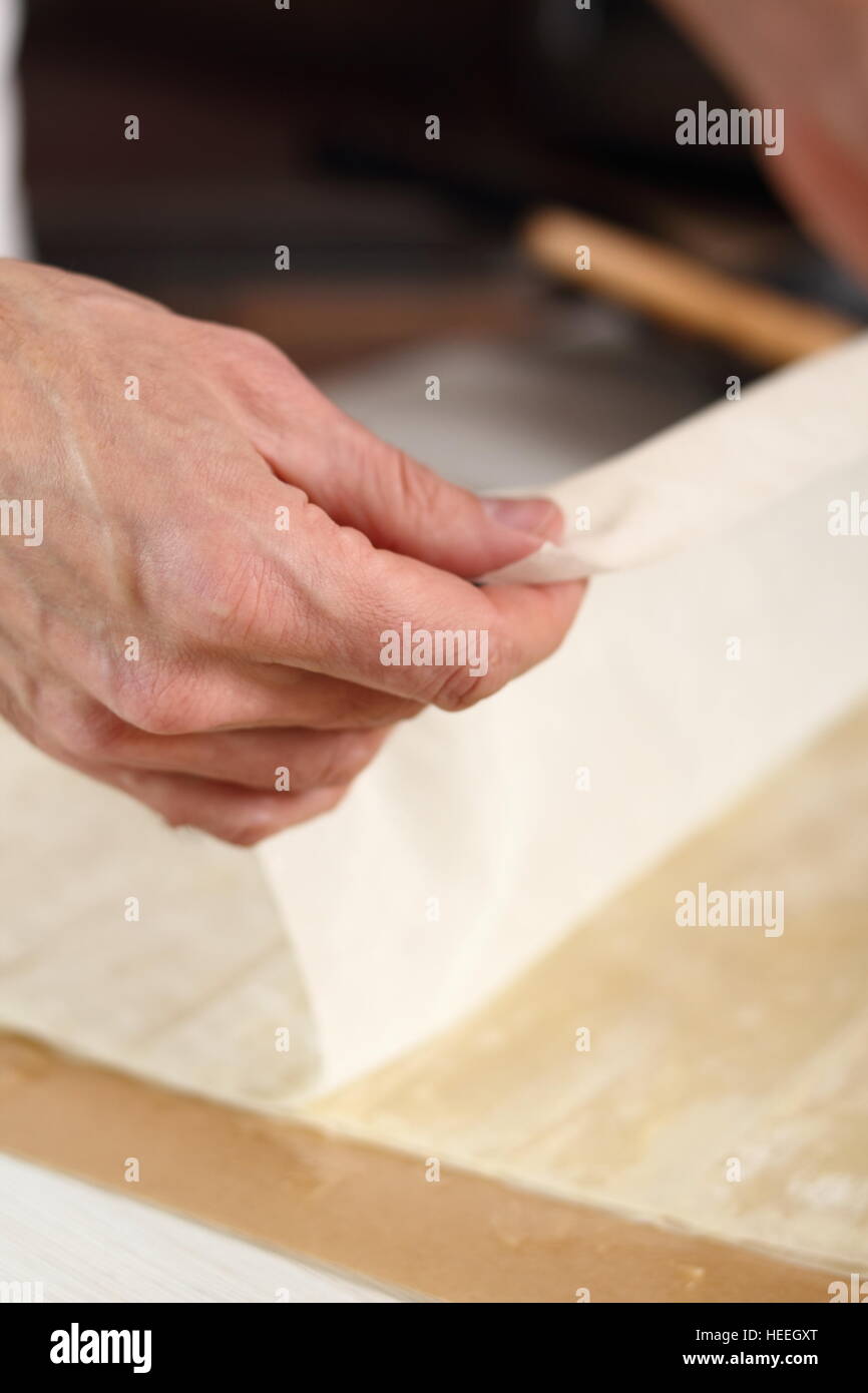 Stacking filo pastry sheet. Making Filo Pastry Topped Apple Pie Series ...