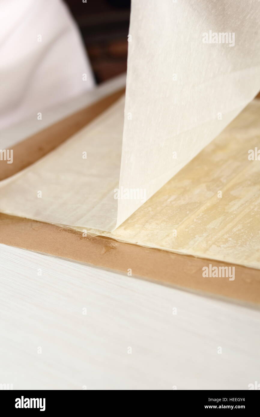 Stacking filo pastry sheet. Making Filo Pastry Topped Apple Pie Series ...