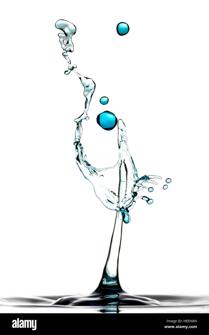 Water droplets colliding captured using high speed flash technique ...