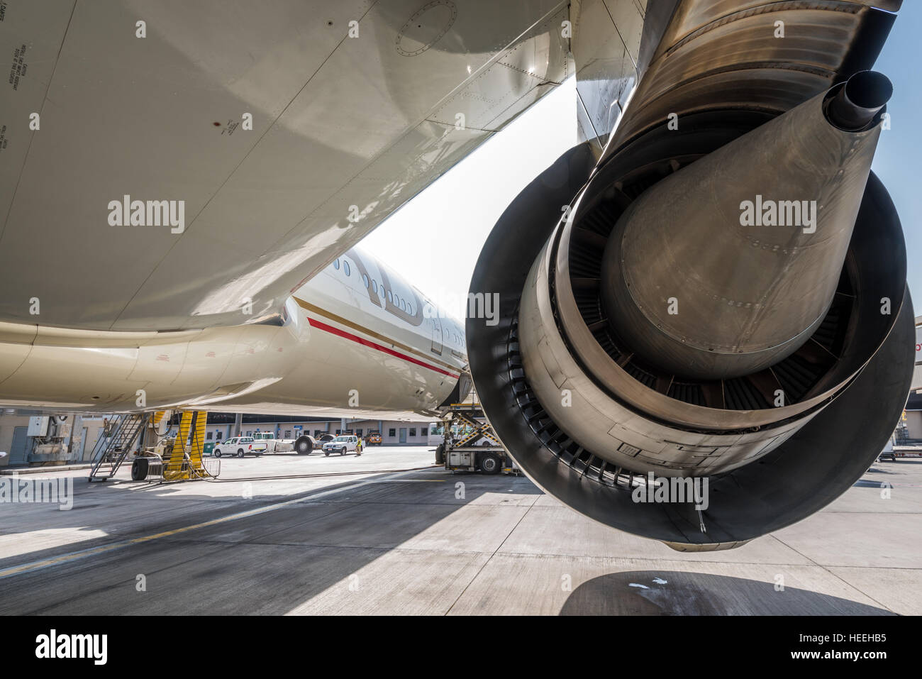 Large transport aircraft parked on an airport apron. View from behind ...
