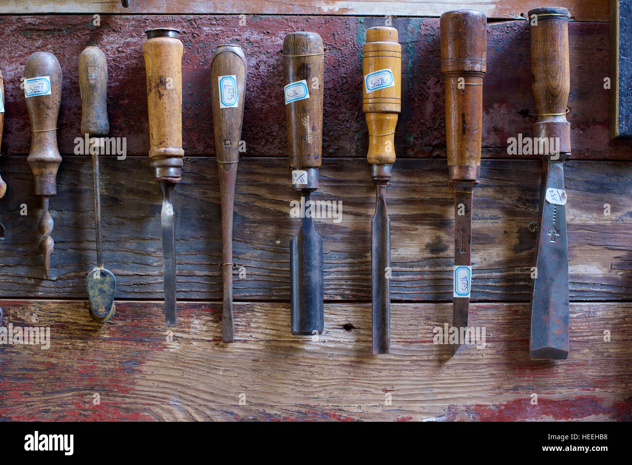 Old Chisels on wooden Walls Stock Photo - Alamy