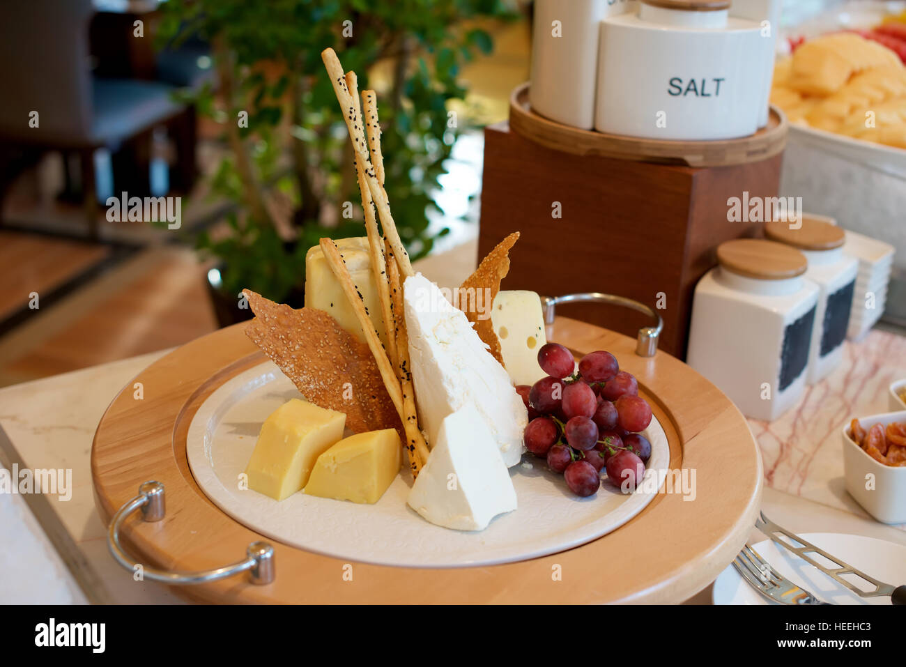 Assorted Cheese platter appetizer on plate Stock Photo - Alamy