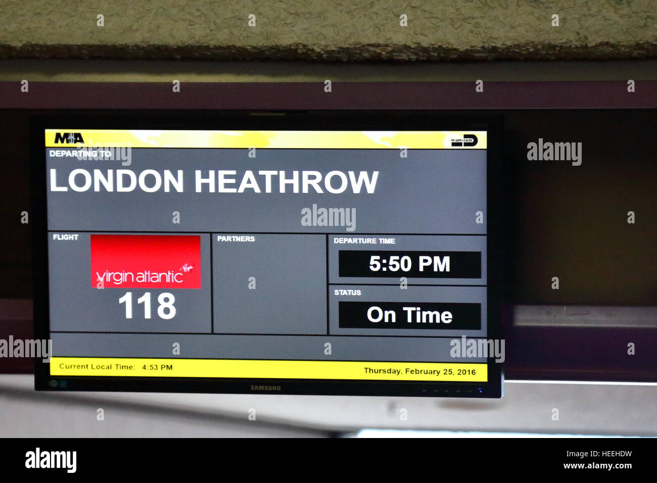 Flight display at the gate at Miami International airport Stock Photo ...