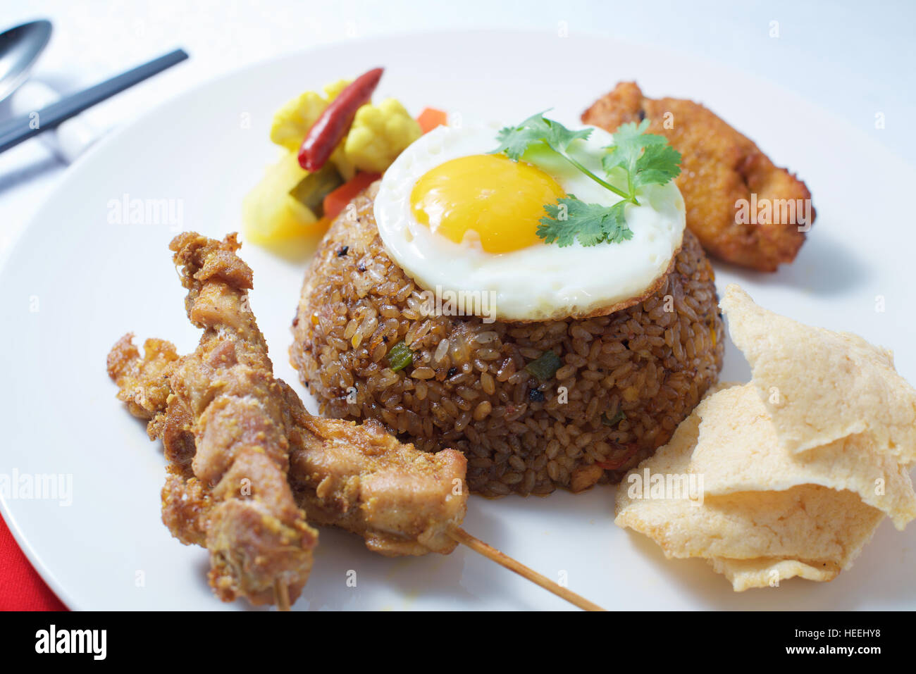 Indonesian Fried Rice dish on white background Stock Photo - Alamy