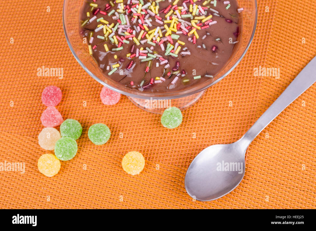 Portion of chocolate pudding decorated with sugar sprinkles Stock Photo ...