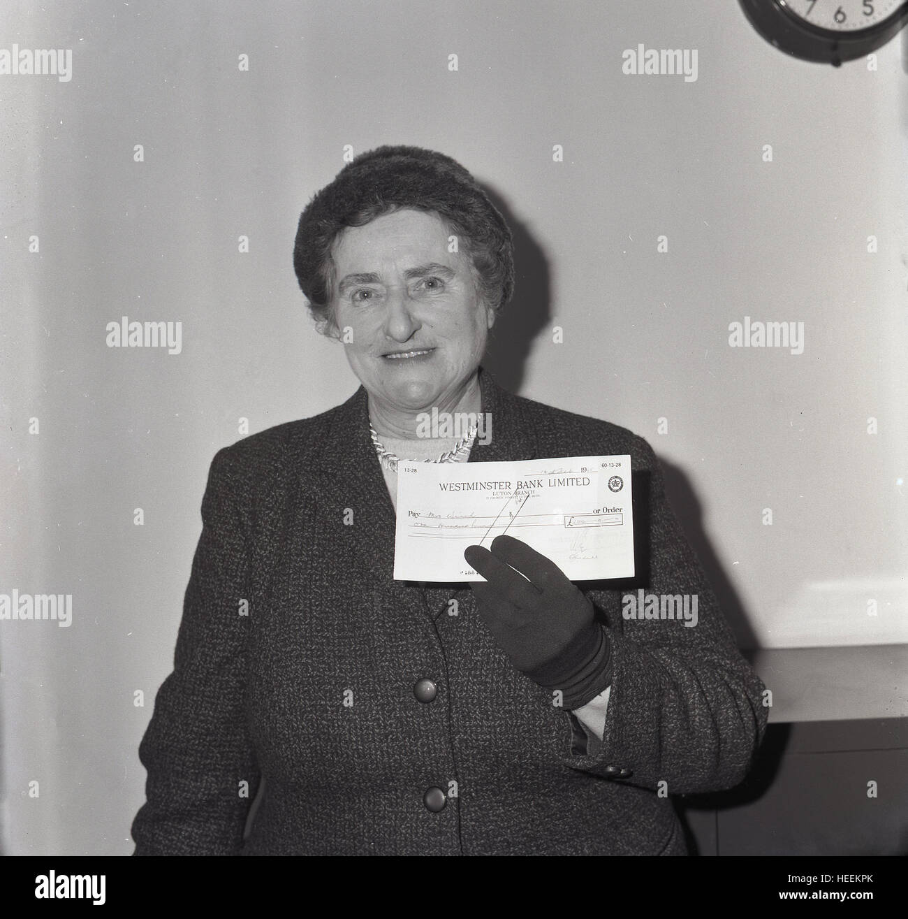 1965, historical, 'spot the ball' winner, an elderly lady holds up a ...