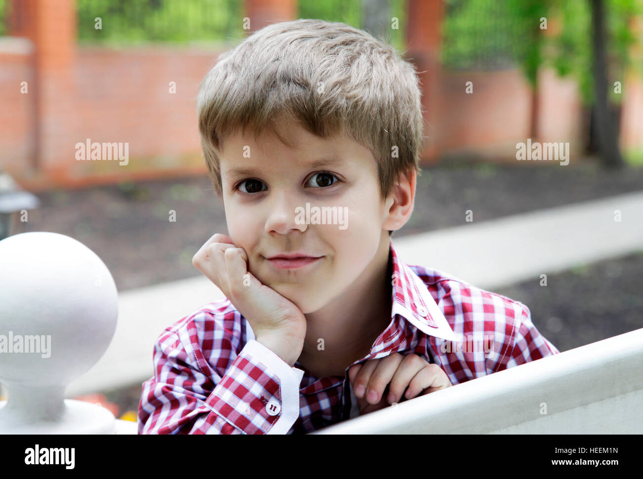 Portrait of the boy on a beige background Stock Photo - Alamy