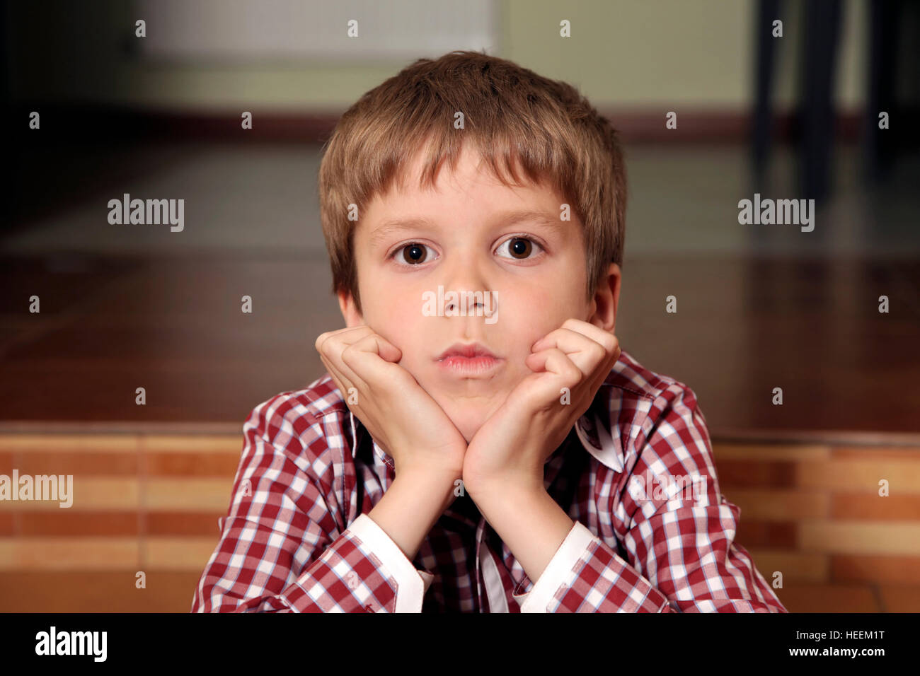 Portrait of the thoughtful boy at home Stock Photo - Alamy