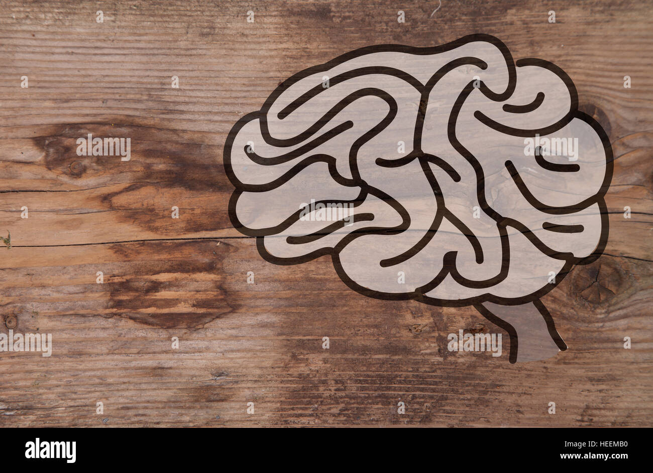Illustration of a brain on wooden background Stock Photo - Alamy