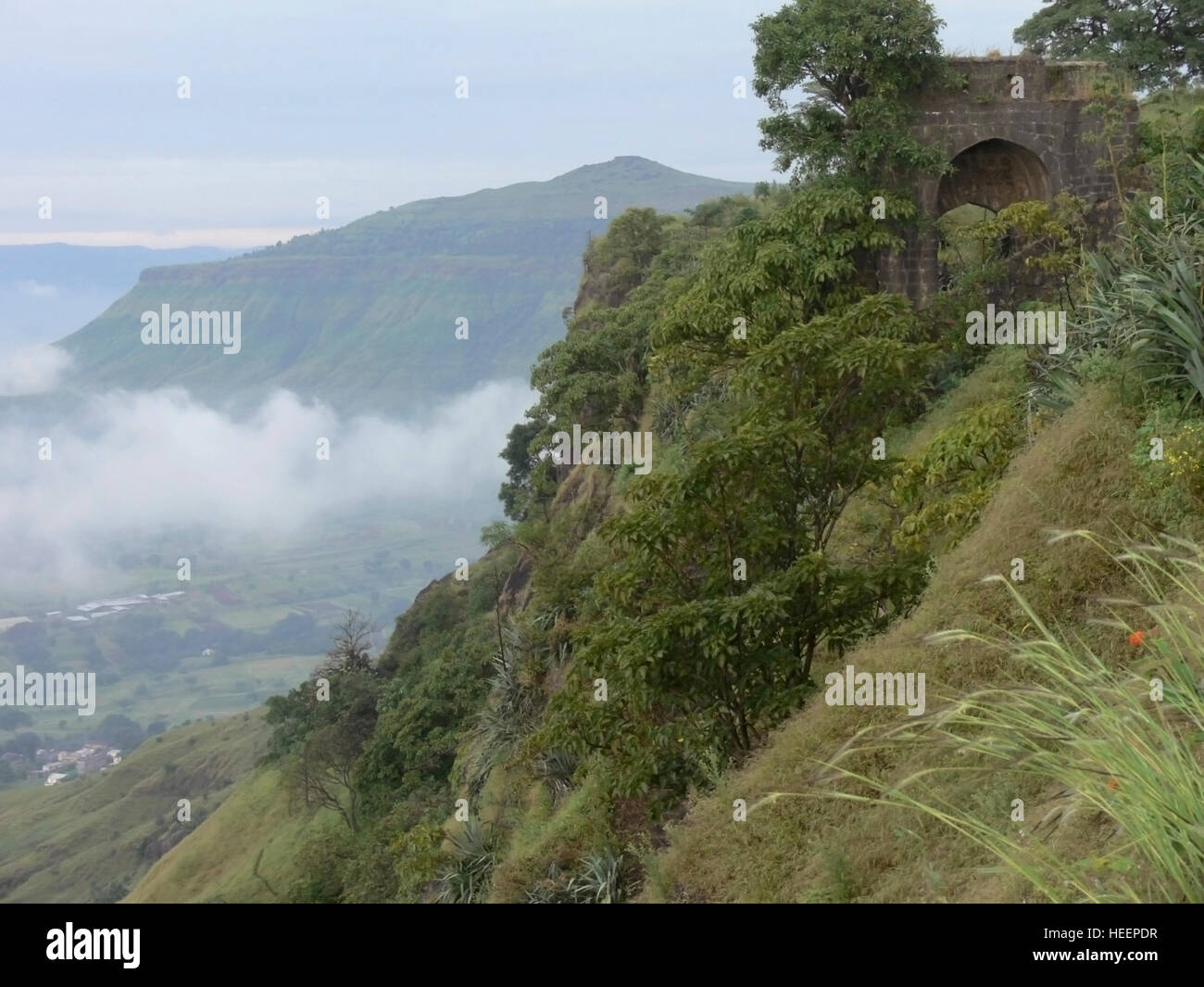 One of the Entrance doors of Ajinkyatara fort with adjoining valley and ...
