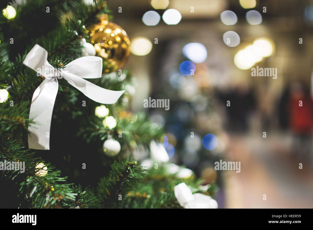Decorated Christmas tree in store. Toned photo Stock Photo - Alamy