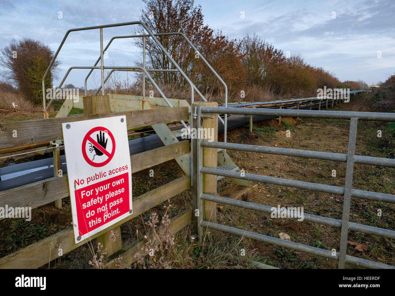 Warning notice seen at the entrance to a large quarry facility showing ...