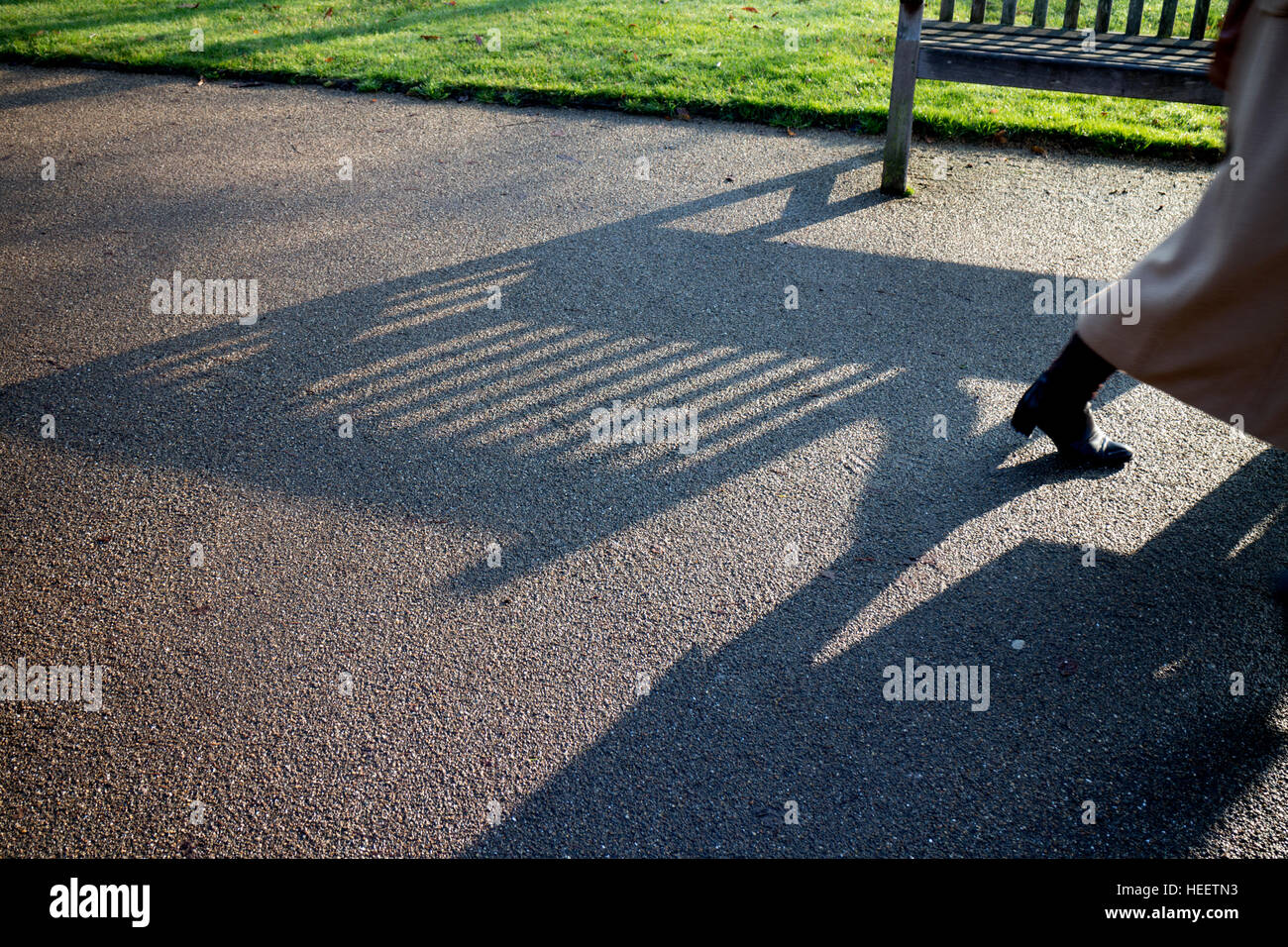 Winter sun woman walking shadow hi-res stock photography and images - Alamy