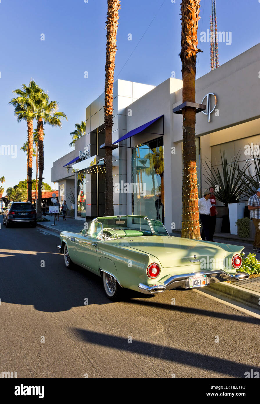 Prestige upscale shopping with a convertible 1960's T-Bird in front of ...