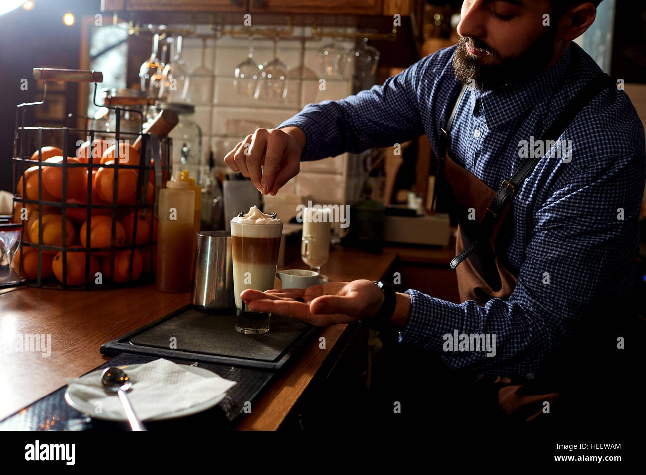 Barman barista in uniform making coffee tea, cocktails Stock Photo - Alamy