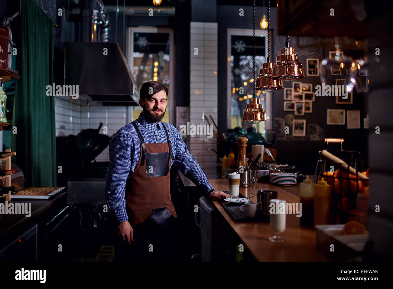 Barman barista in uniform making coffee tea, cocktails Stock Photo - Alamy